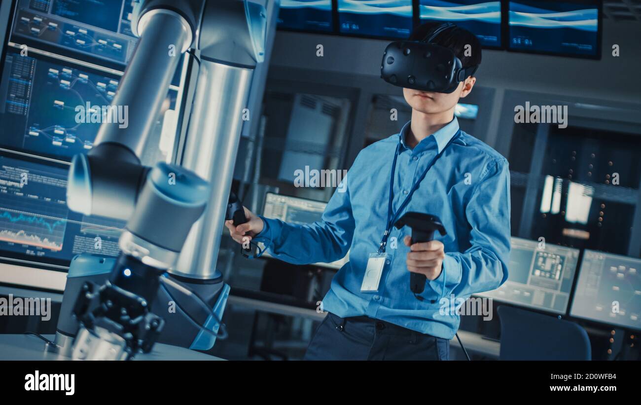 Professional Japanese Development Engineer in Blue Shirt is Controlling ...