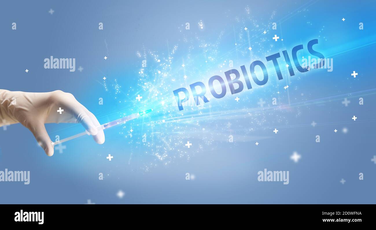 Syringe, medical injection in hand with PROBIOTICS inscription, medical ...