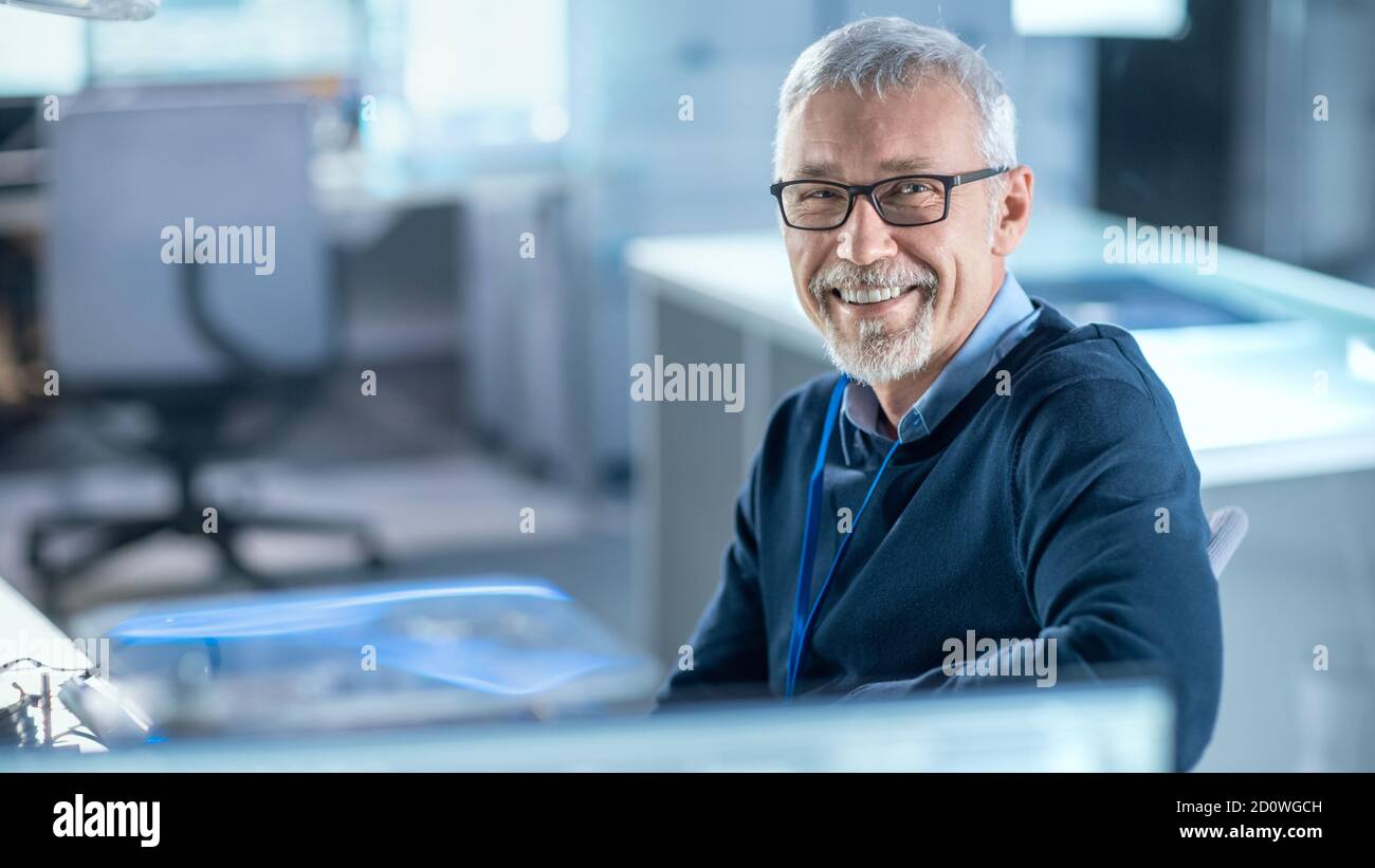 Professional Electronics Design Engineer Wearing Glasses Works in ...