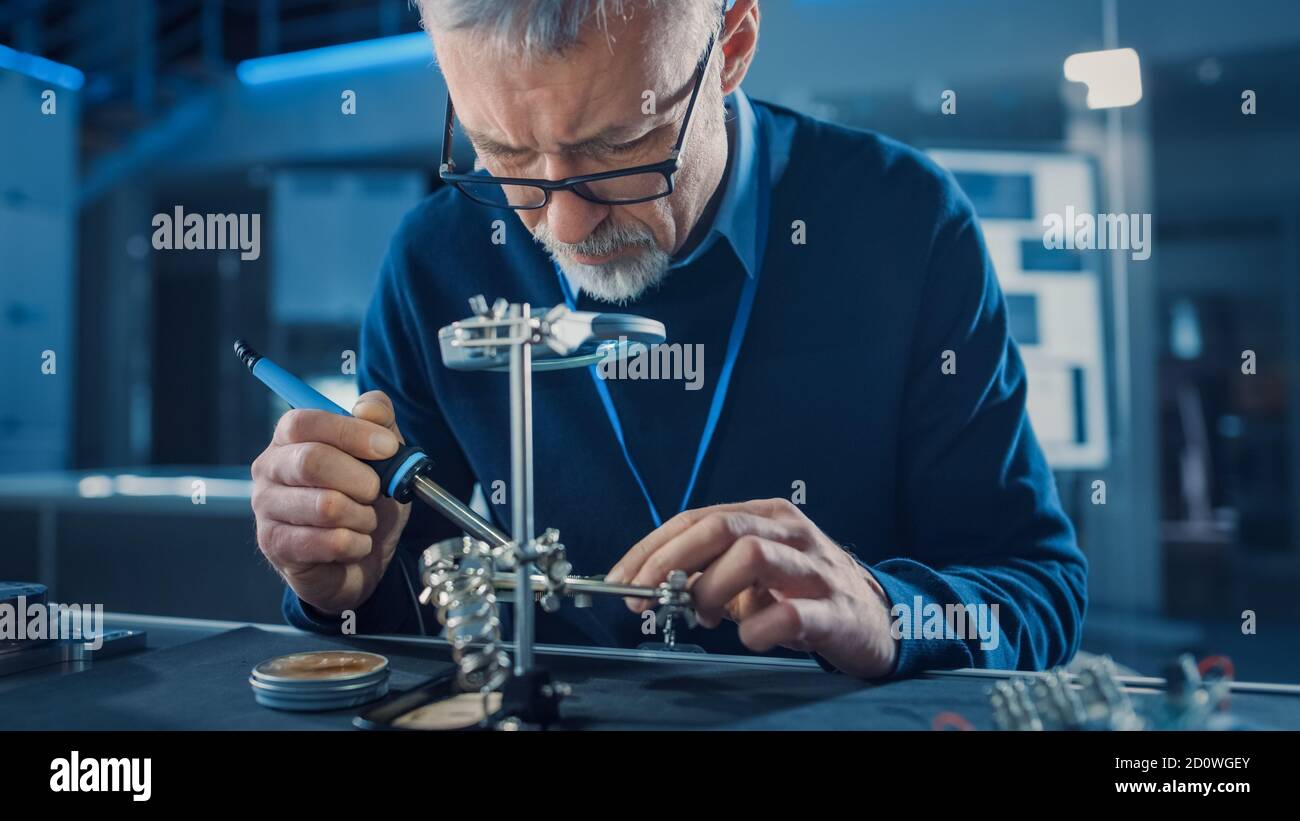 Electronics Maintenance Engineer Soldering Motherboard, Microchip and ...