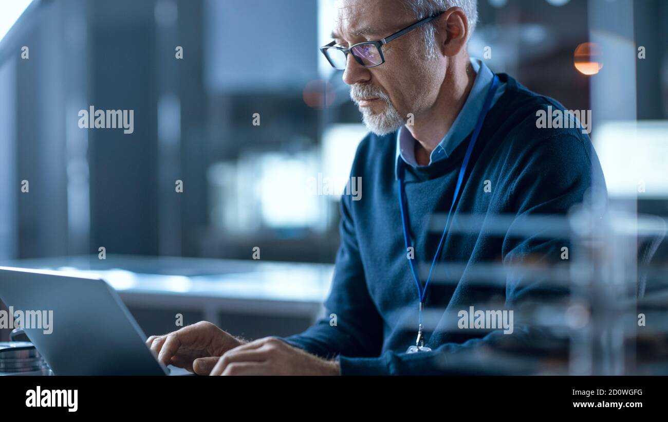 Professional Electronics Design Engineer Wearing Glasses Works on ...