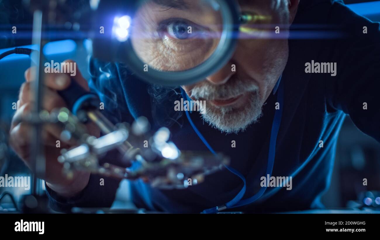 Electronics Maintenance and Repair Engineer Soldering Motherboard ...