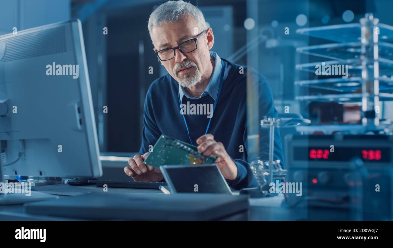 Electronics Maintenance Engineer Soldering Motherboard, Microchip and Circuit Board, Looking ...