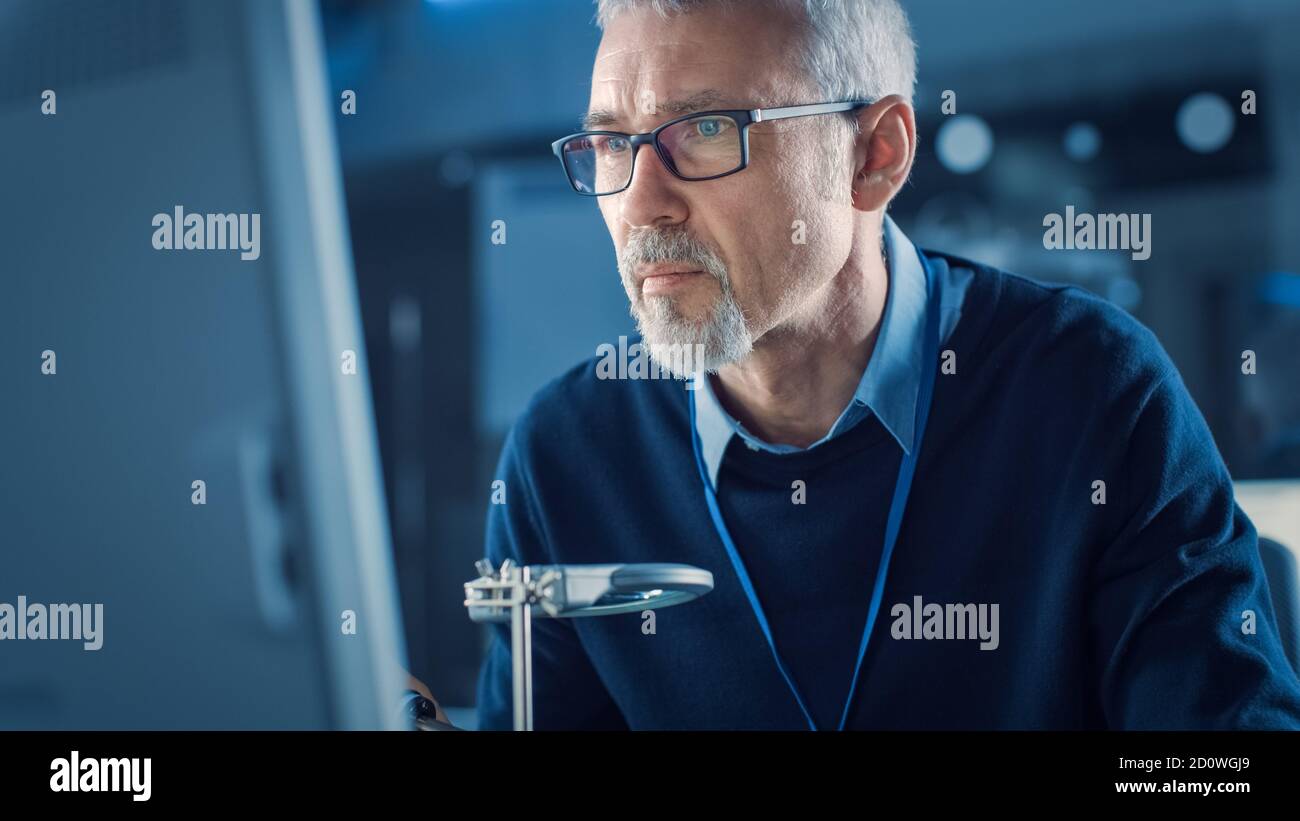 Electronics Maintenance Engineer Soldering Motherboard, Microchip and ...