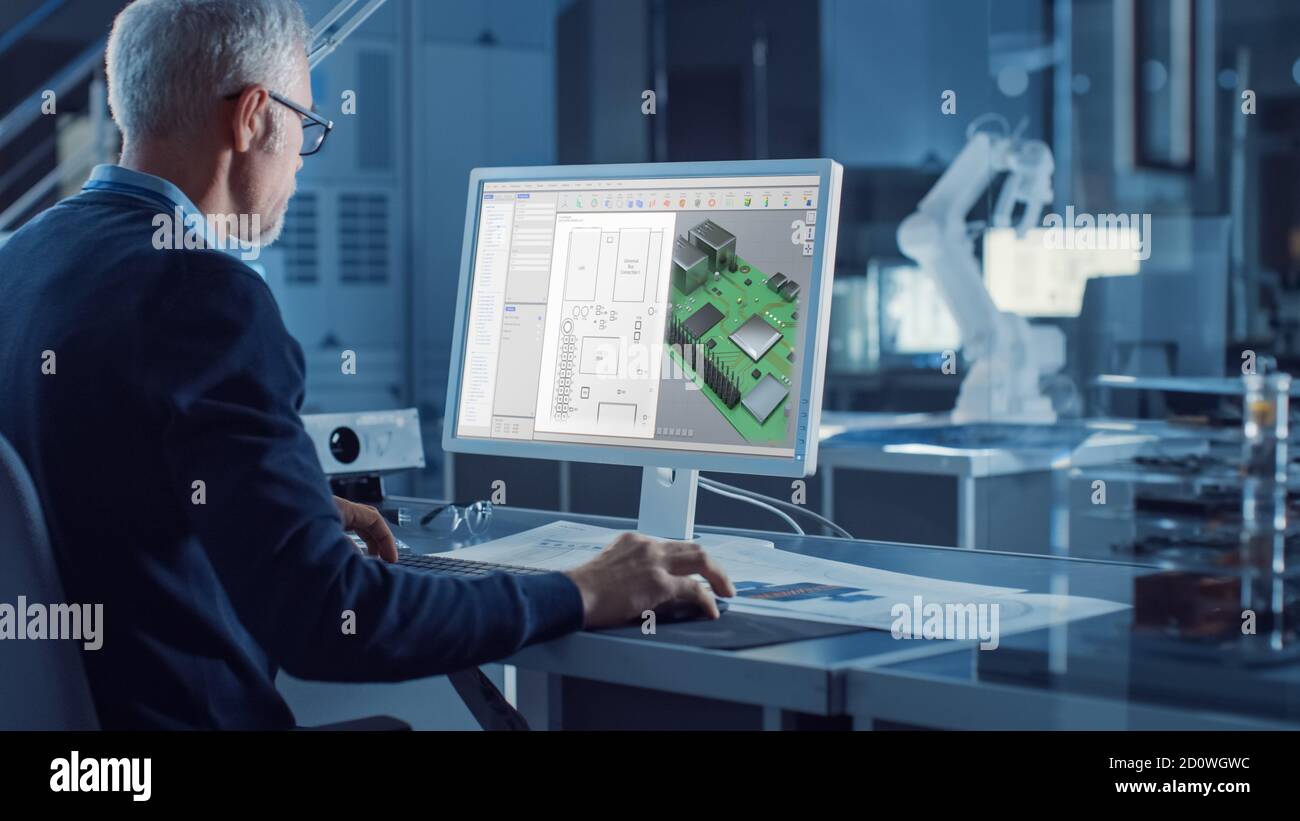 Engineer Works on Computer Uses CAD Software to Design 3D Industrial ...