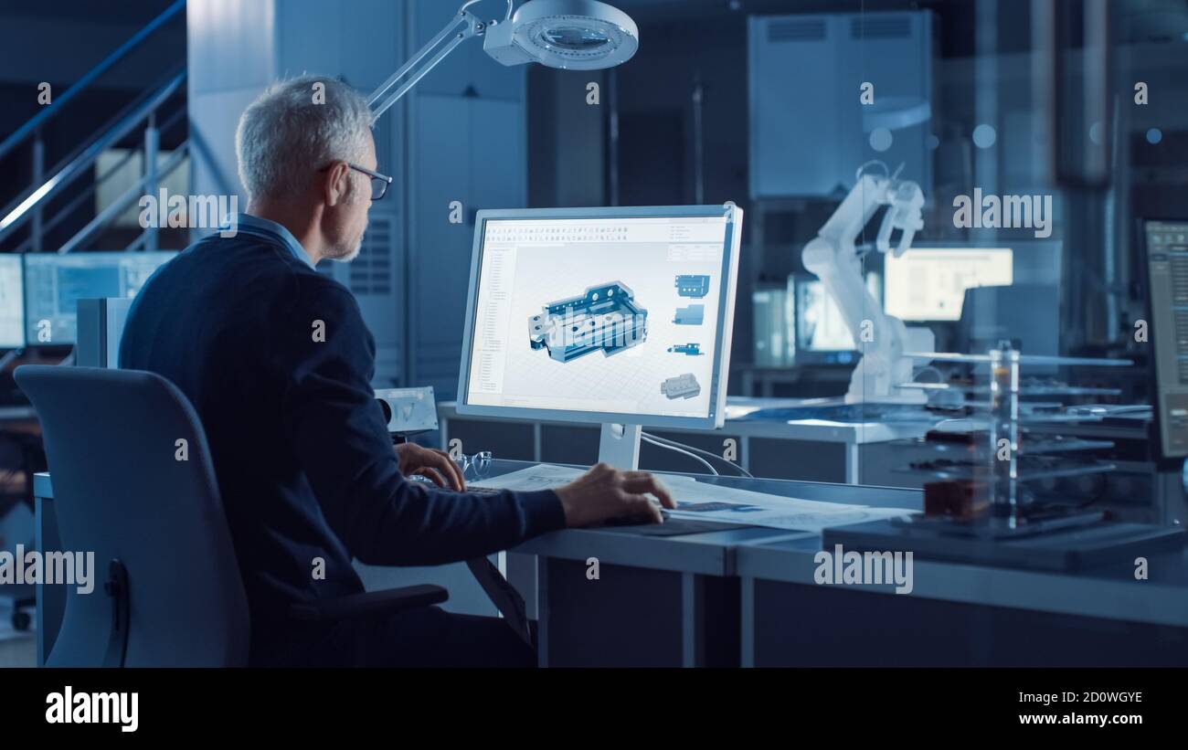 Engineer Works on Computer Uses CAD Software to Design 3D Industrial ...