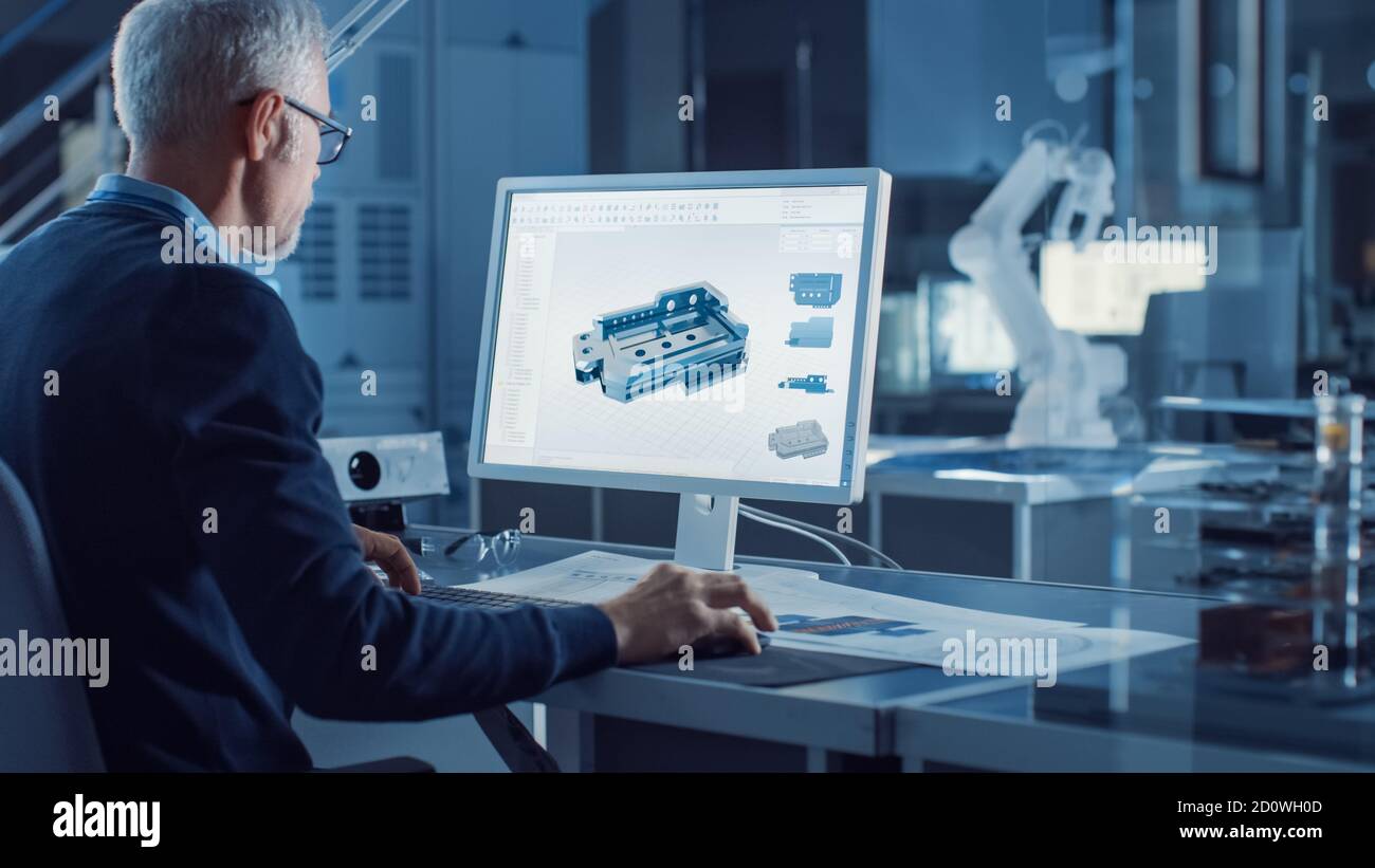 Professional Heavy Industry Engineer Works on Computer Uses CAD ...