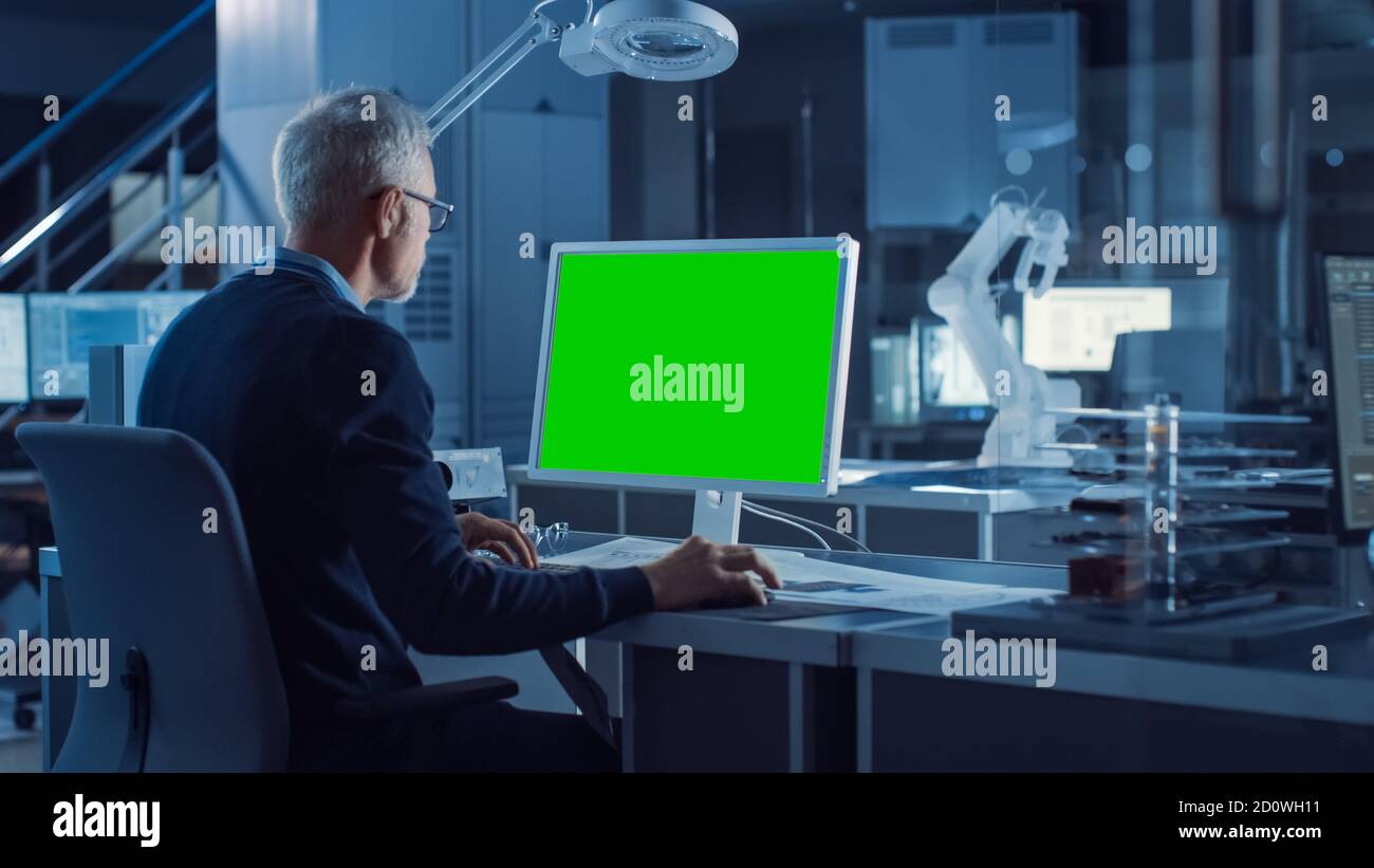 Professional Heavy Industry Engineer Works on Green Mock-up Screen ...