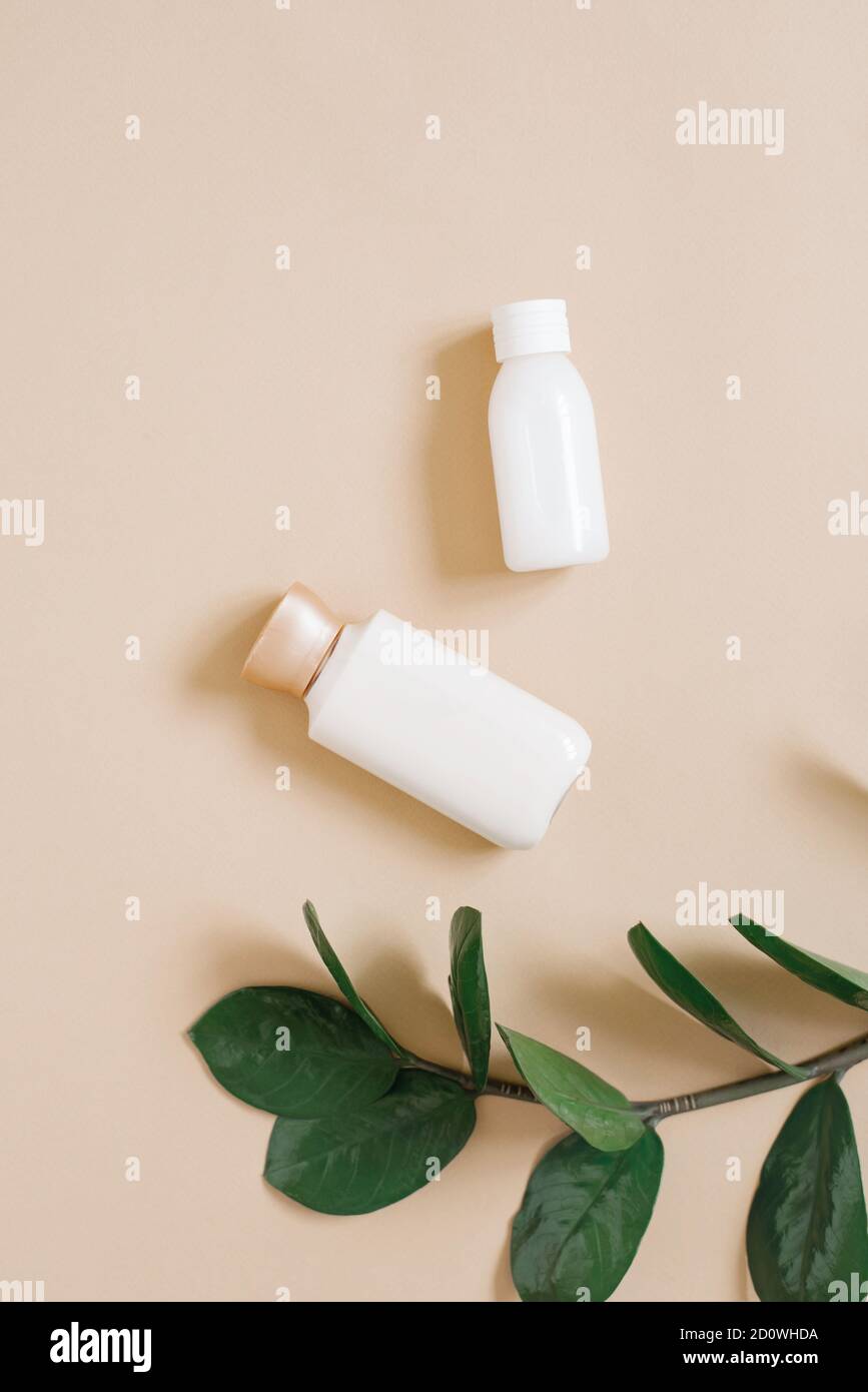 The concept of plant-based, organic cosmetics. Bottles with body or ...