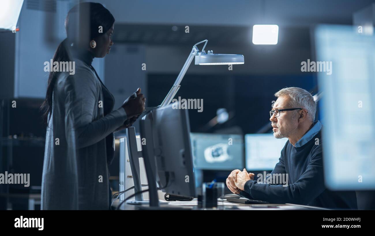Shot of Male Industrial Engineer Talking with Female Manager about New ...