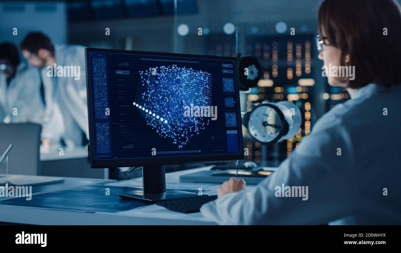 Over the Shoulder Shot: Female IT Scientist Uses Computer Showing ...