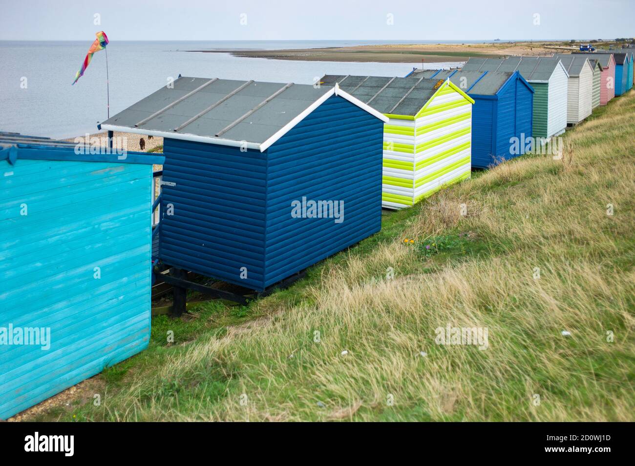 Traditional colorful English beach huts in Whitstable, Kent in the ...
