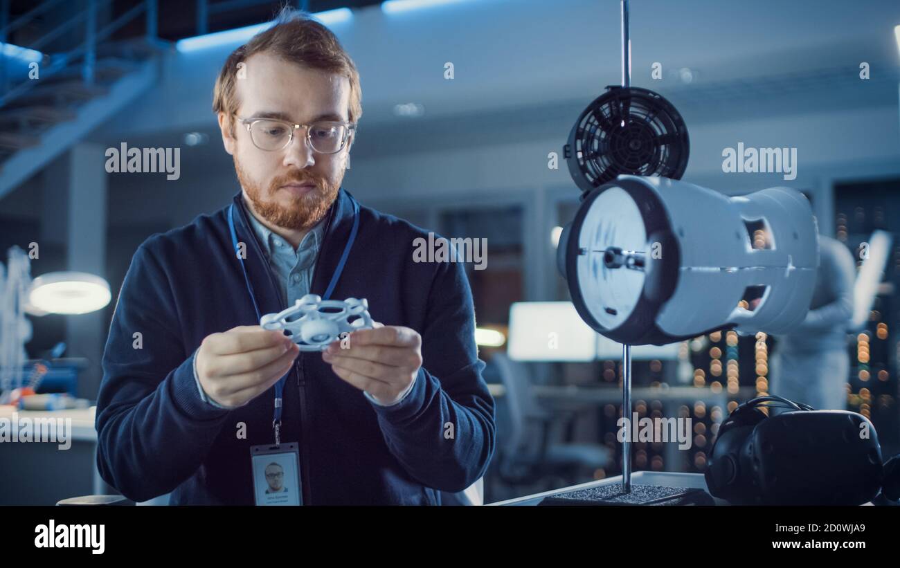 Electronics Development Engineer Working at His Desk, Fits New ...