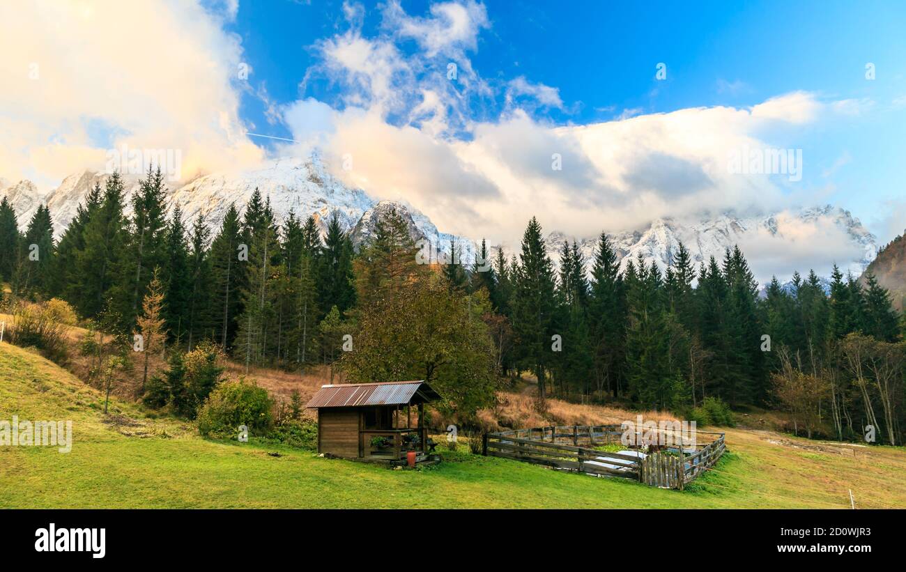 an alpine hut in the valley during a colorful sunrise Stock Photo - Alamy