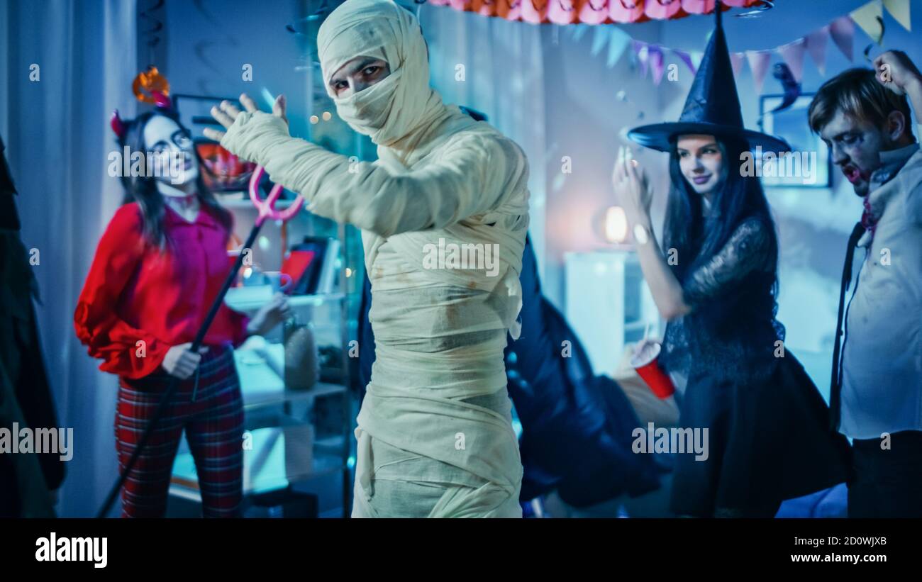 Halloween Costume Party: Old Skinny and Bandaged Mummy Dances. In the ...