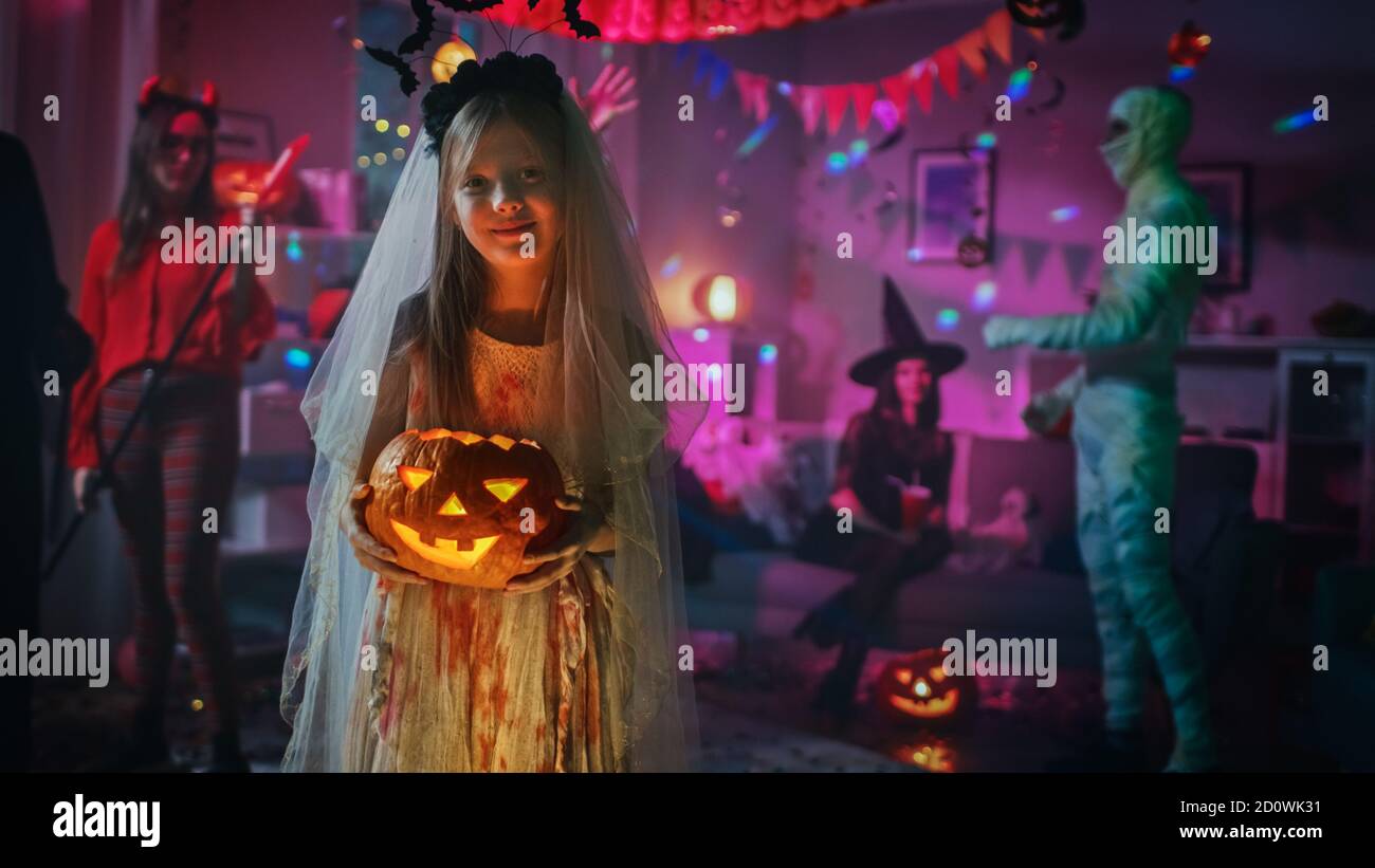 Halloween Costume Party: Smiling Little Girl in a Bloody White Bride ...