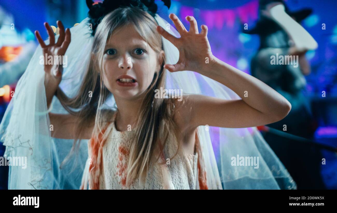 Halloween Costume Party: Little Girl in a Bloody White Bride Dress ...