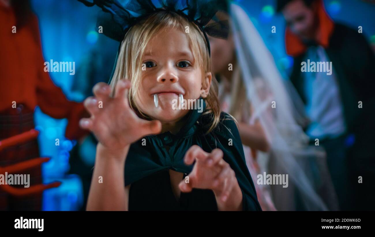 Halloween Costume Party: Cute Little Bat Girl with Sharp Fangs Makes ...