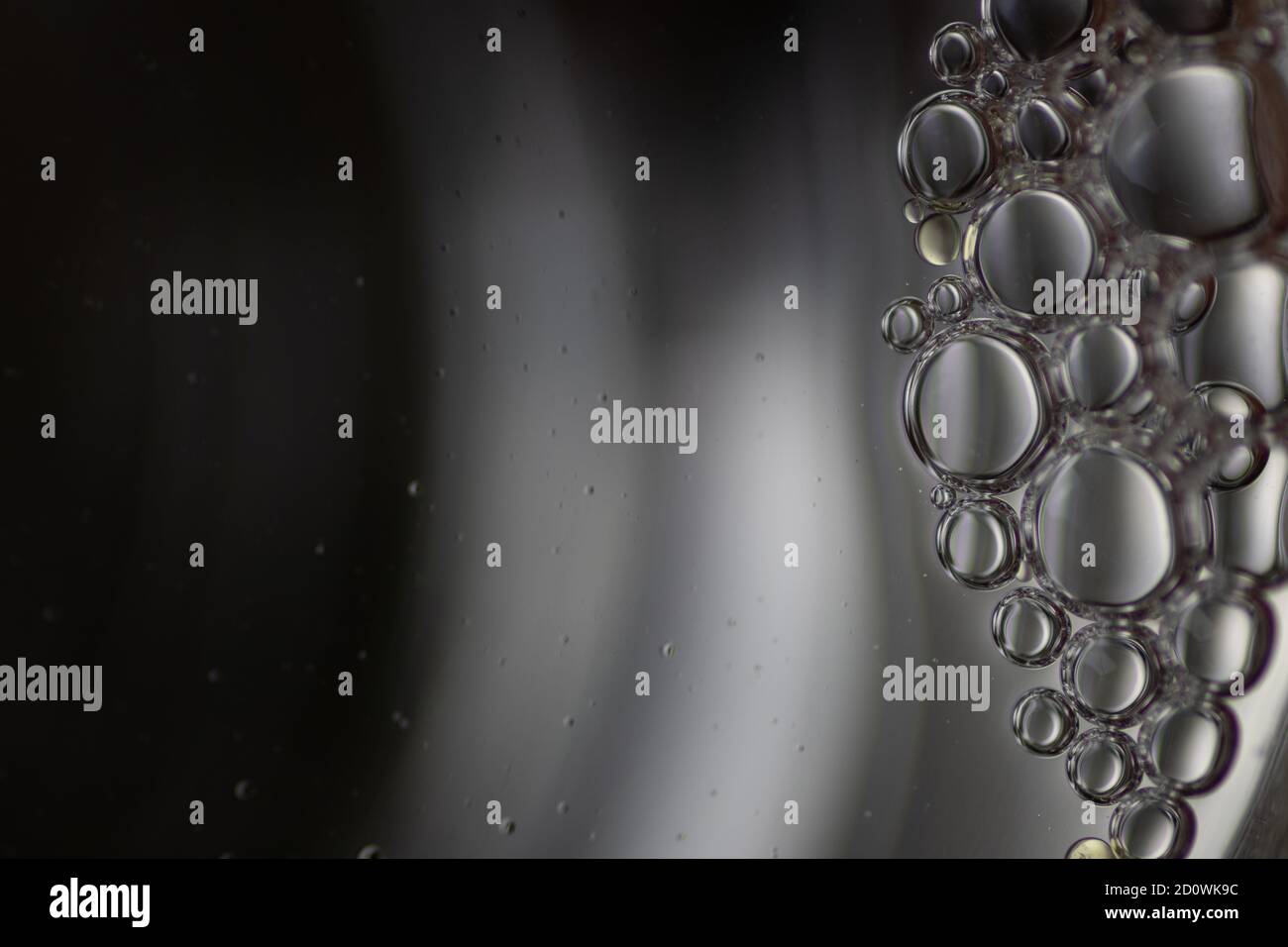 Oil drops in the water create an artistic and imaginatively designed ...