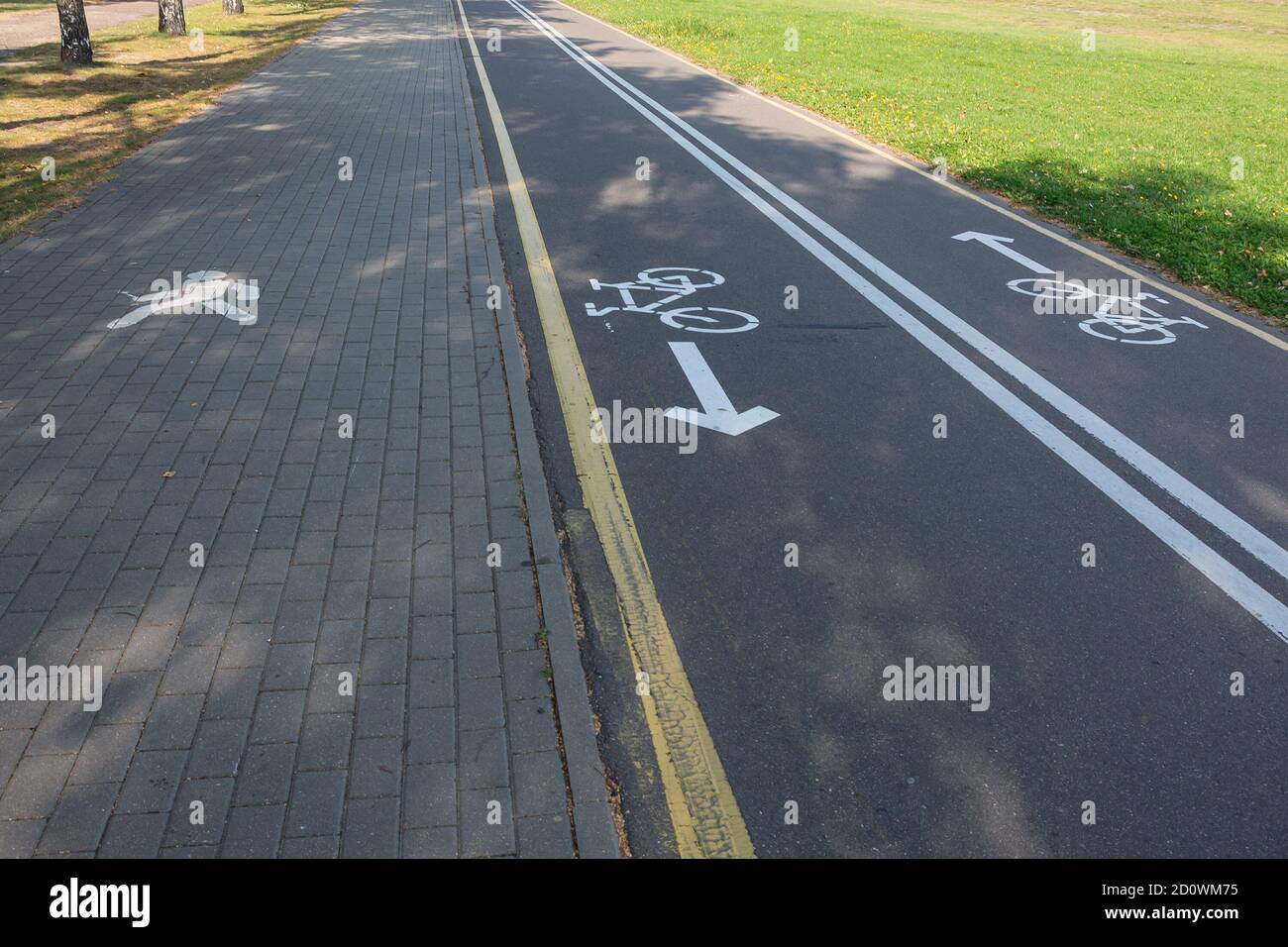 bike path with a Bicycle sign and a sidewalk with a pedestrian sign ...