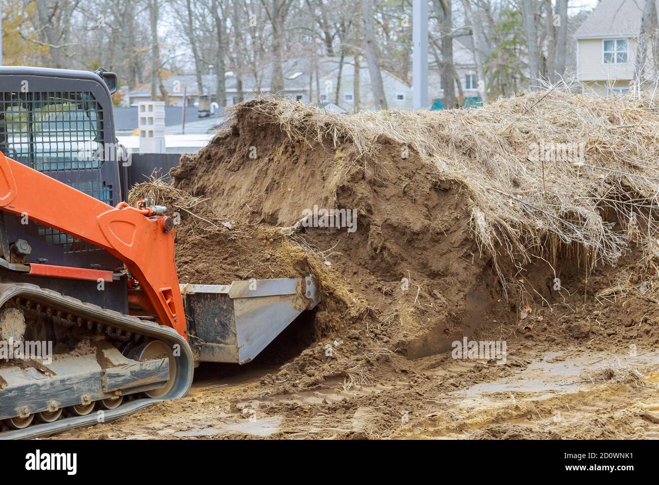 Small tractor digging land working with land level the ground Stock ...