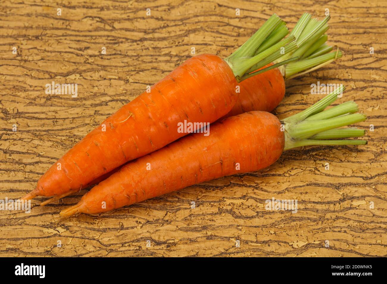 Three Young fresh ripe carrots Stock Photo - Alamy