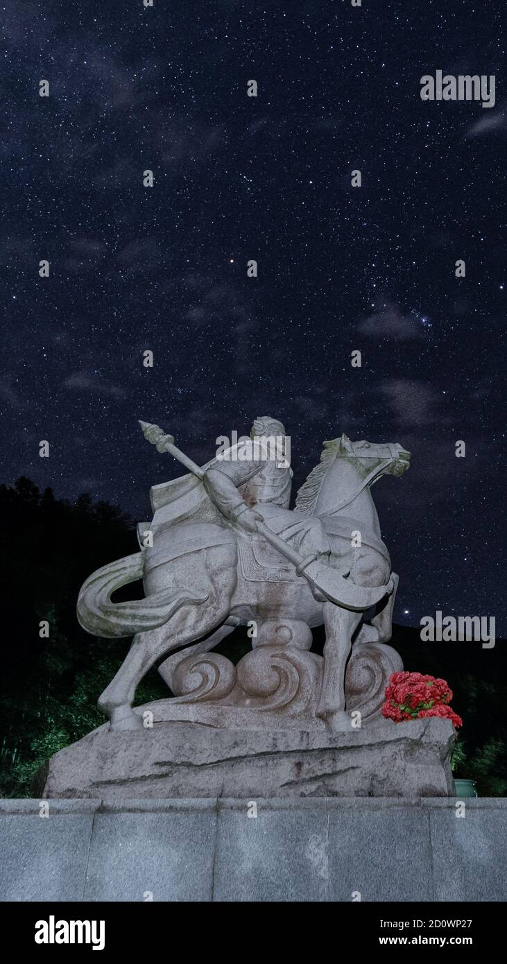 Stone statue at night with stars in the background Stock Photo - Alamy