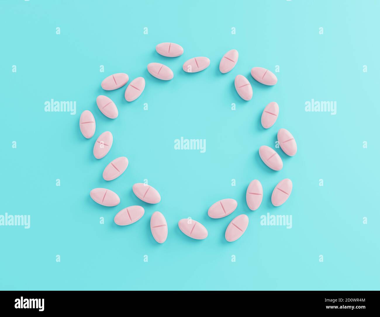 pink pills form a circle on the blue table. Medical, pharmacy and ...