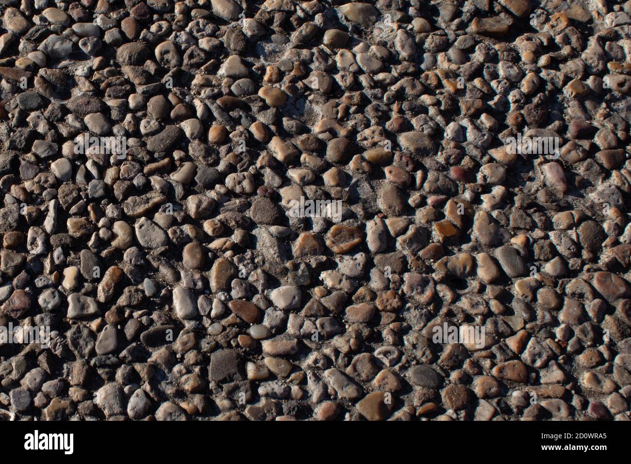 architectural texture of small brown stones Stock Photo - Alamy