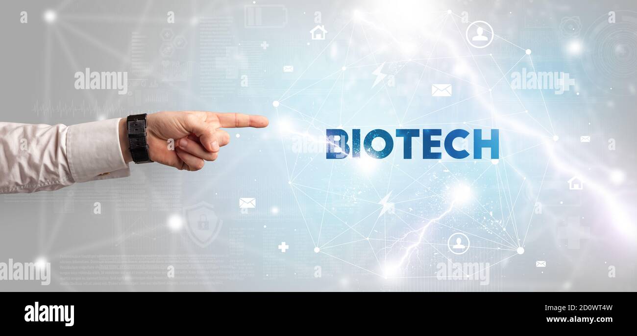 Hand pointing at BIOTECH inscription, modern technology concept Stock ...