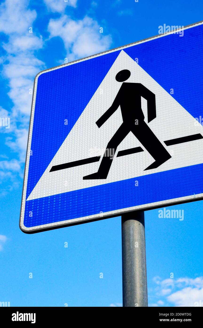 Vertical shot of a traffic sign showing crossing pedestrian Stock Photo ...