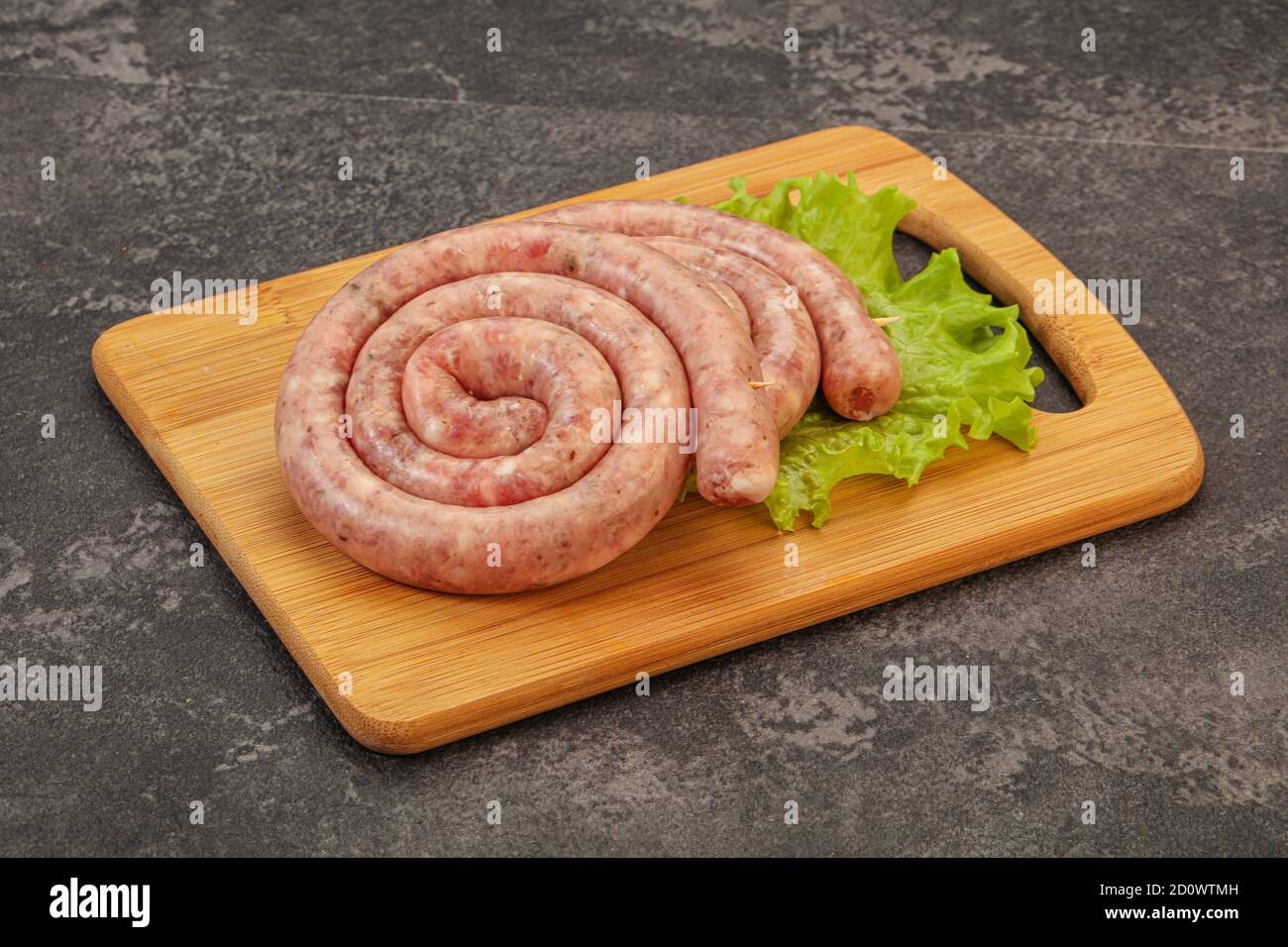 Raw pork sausage ring for grill Stock Photo - Alamy