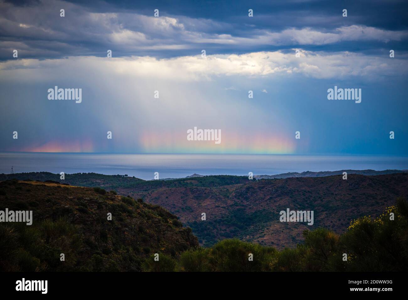 Rainbow on the sea, Spain Stock Photo - Alamy