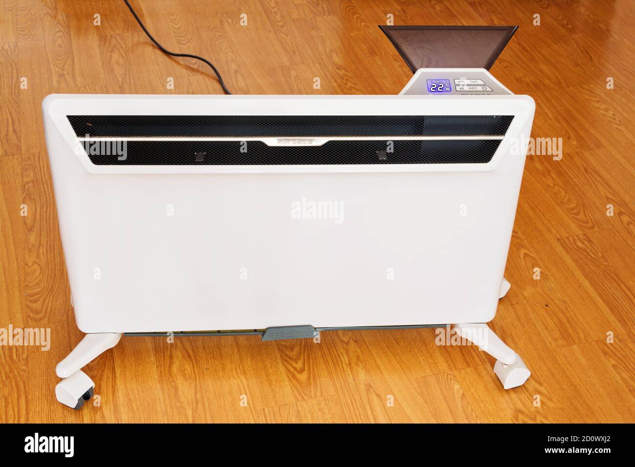 The household electric convector heats the living space Stock Photo - Alamy