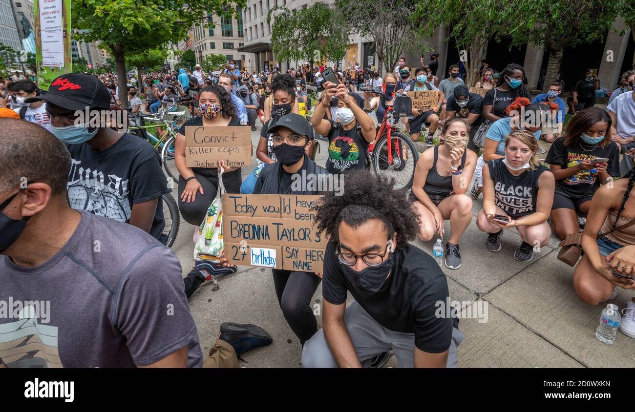 Crowd kneeling together at Black Lives Matter protest in front of white ...