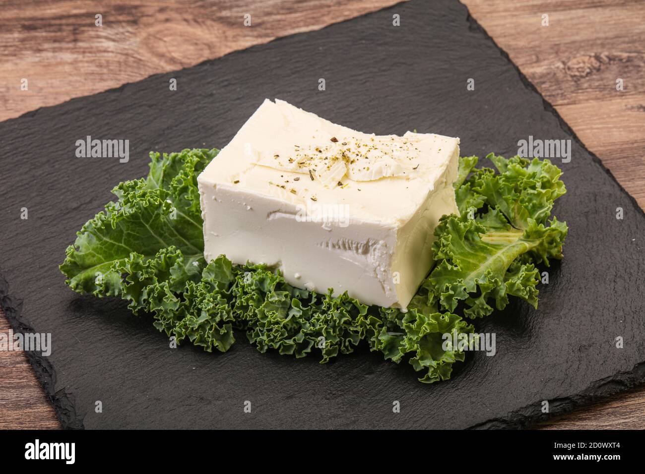 Traditional tasty Greek Feta soft cheese brick Stock Photo - Alamy