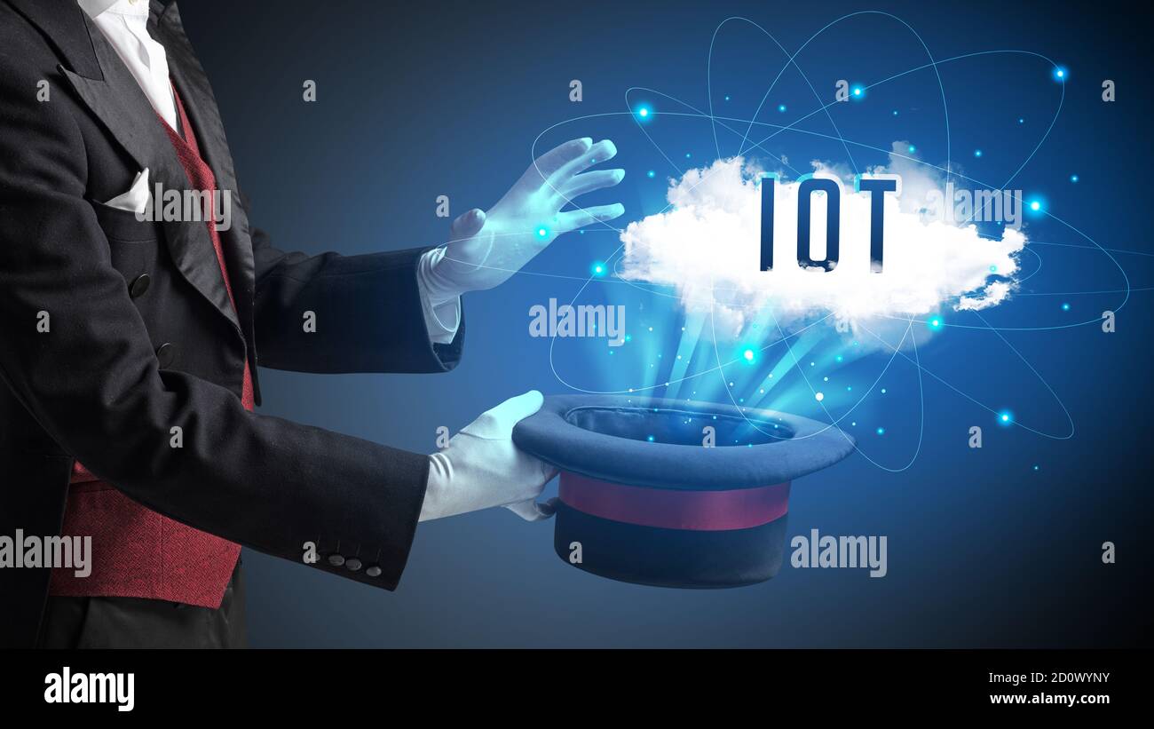 Magician is showing magic trick with IOT abbreviation, modern tech ...