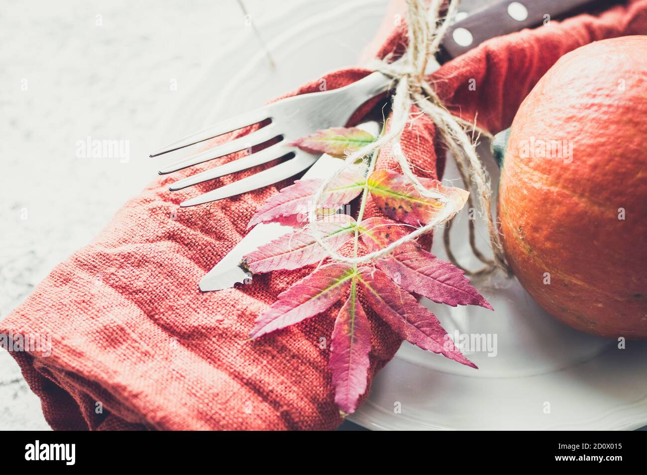 Thanksgiving autumn place setting with cutlery and arrangement of fall ...