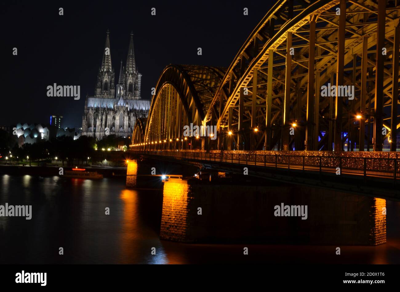 Cologne Cathedral and Hohenzollern Bridge at sunset / nighttime Stock ...