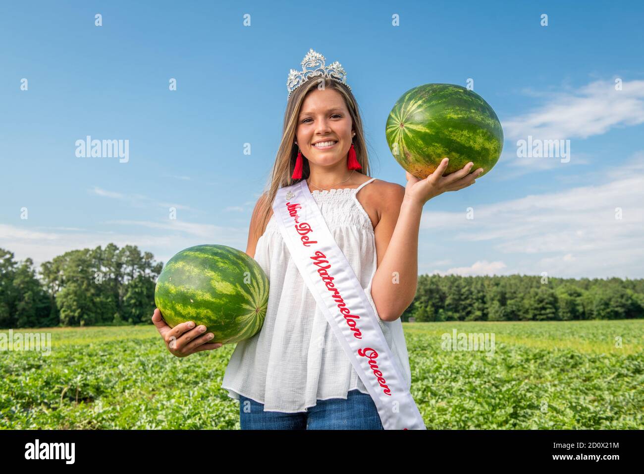 Young woman holding up two watermelons, Mardela Springs, MD Stock Photo ...