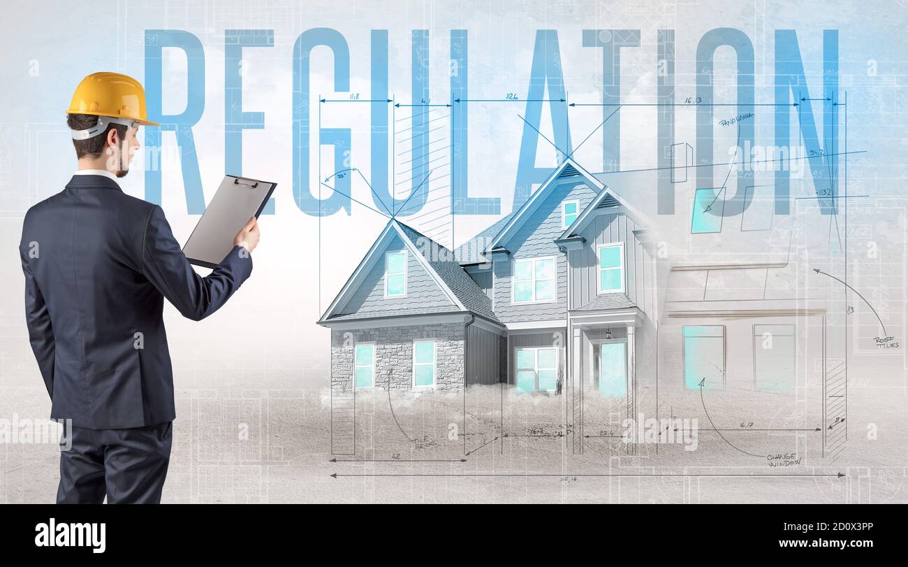 Young engineer holding blueprint with REGULATION inscription, house ...