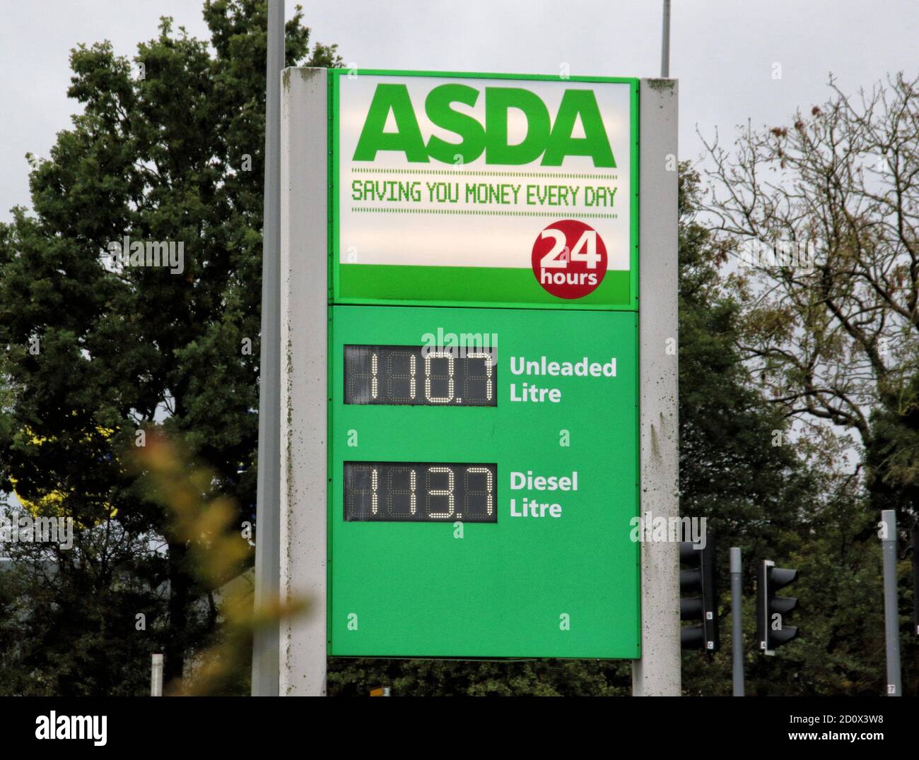 Asda logo seen above one of their petrol stations next to a ...