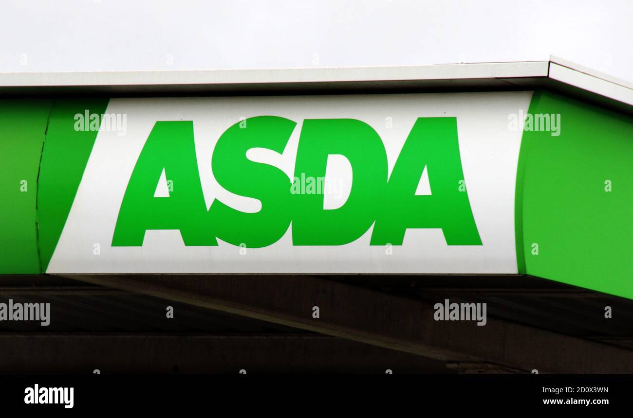 Asda logo seen above one of their petrol stations next to a ...