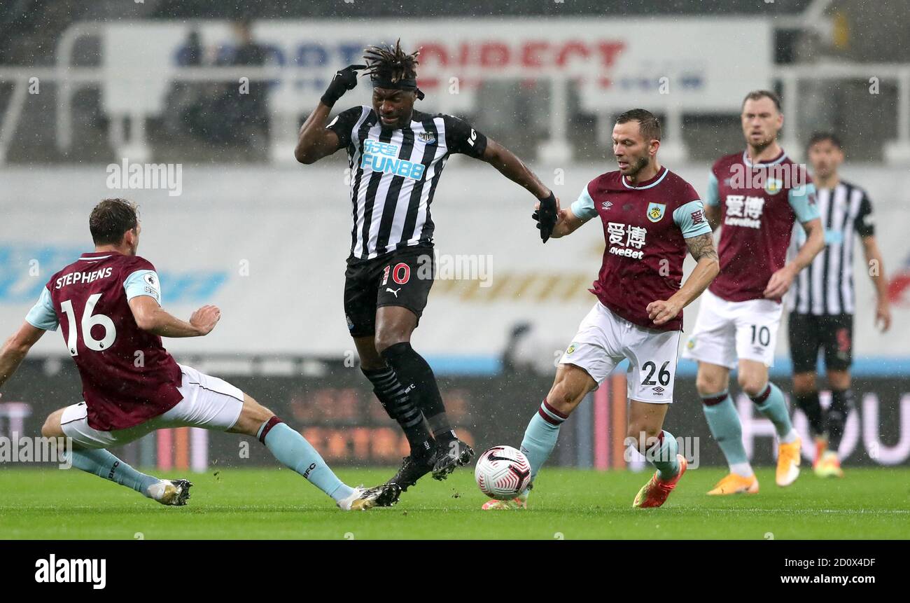 Newcastle United's Allan Saint-Maximin (centre) battles for the ball ...