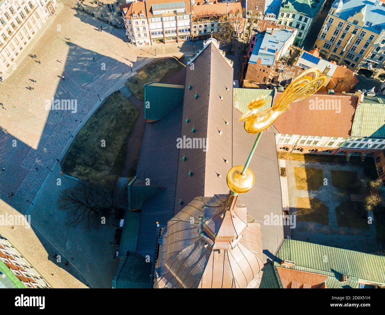 Bird's eye view of a golden rooster on the church roof surrounded by ...