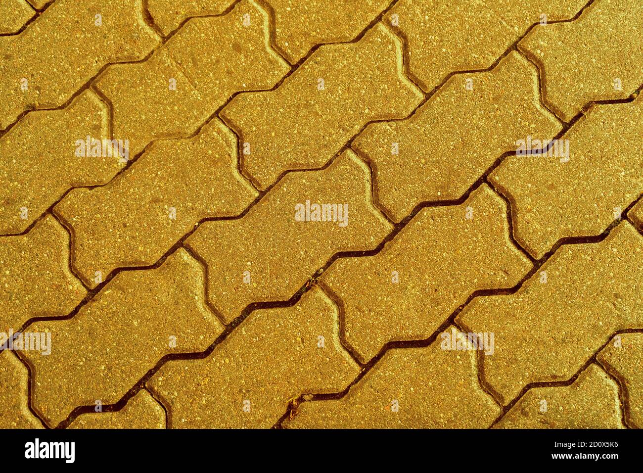Geometric pattern made of square asphalt bricks in gold color Stock ...