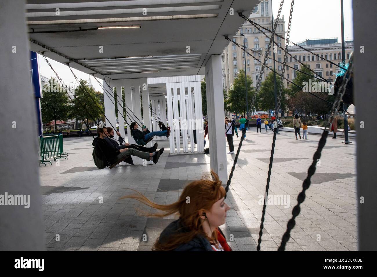 Moscow, Russia. 3rd of October, 2020 People ride a swing on Mayakovsky ...