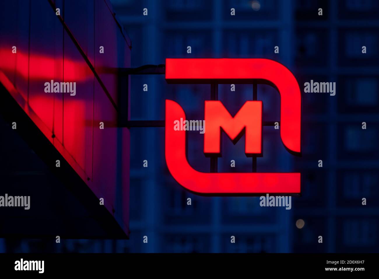 A sign on a grocery store with the logo of the Magnit retail chain on ...