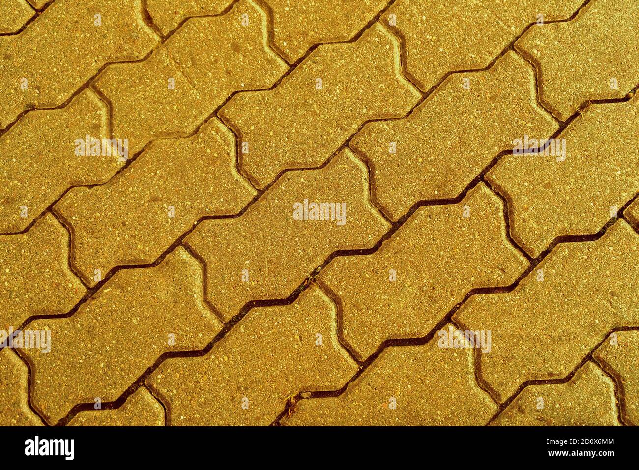 Geometric pattern made of square asphalt bricks in gold color Stock ...
