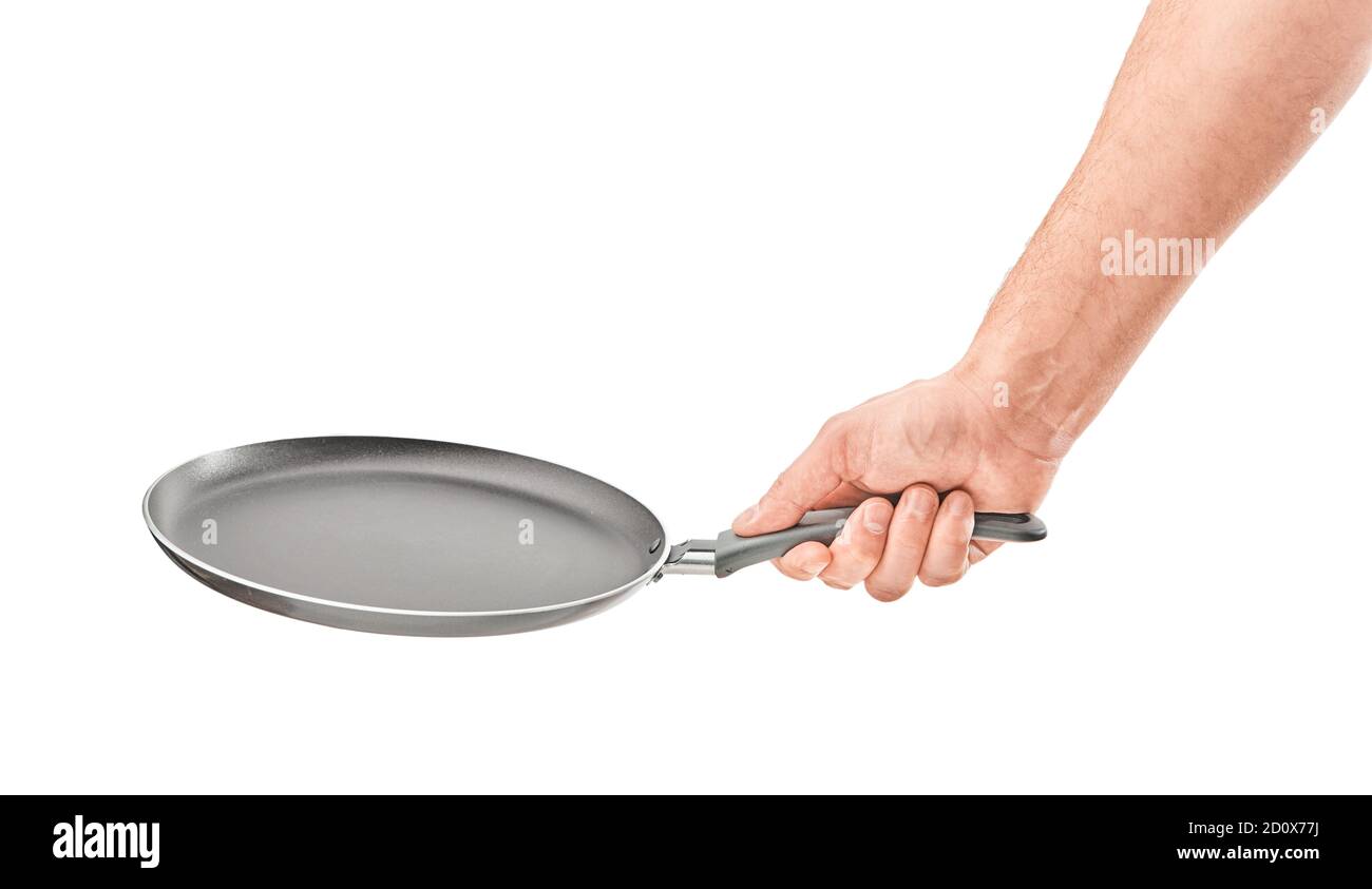 Hand holding a black frying pan isolated on white background Stock ...
